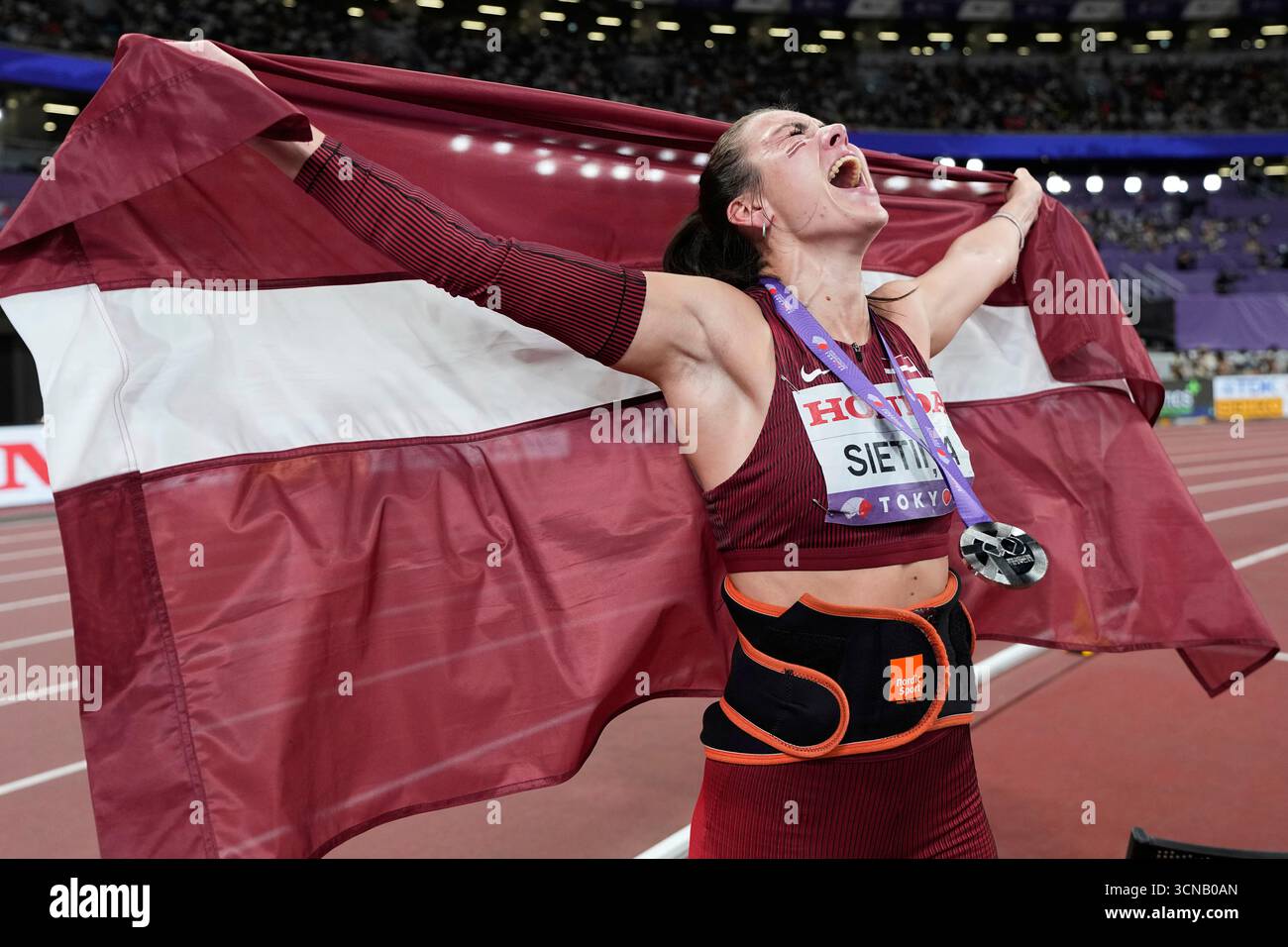Latvia's Anete Sietina reacts after winning the silver medal in the ...