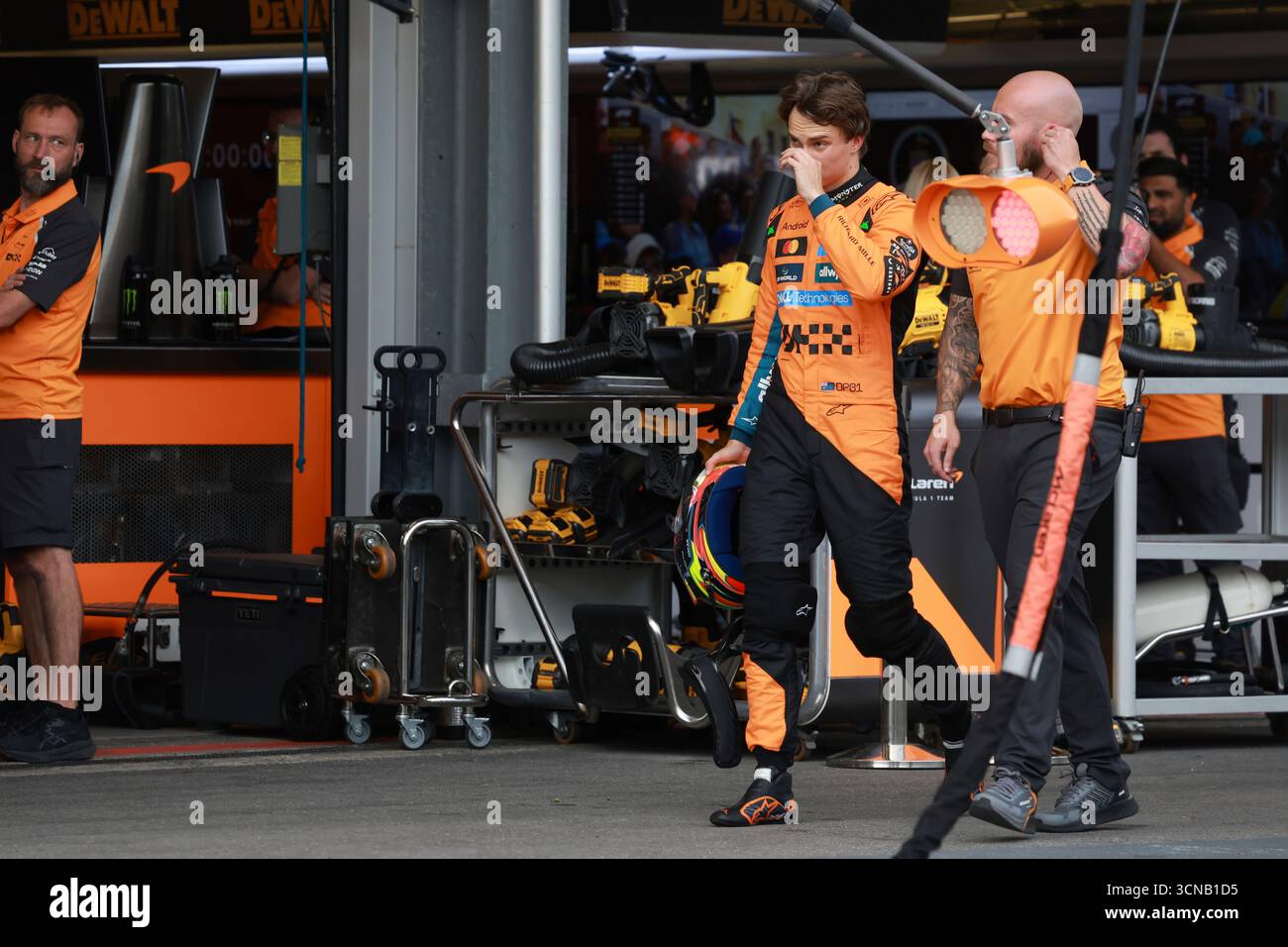 McLaren driver Oscar Piastri of Australia walks in the pit lane during ...