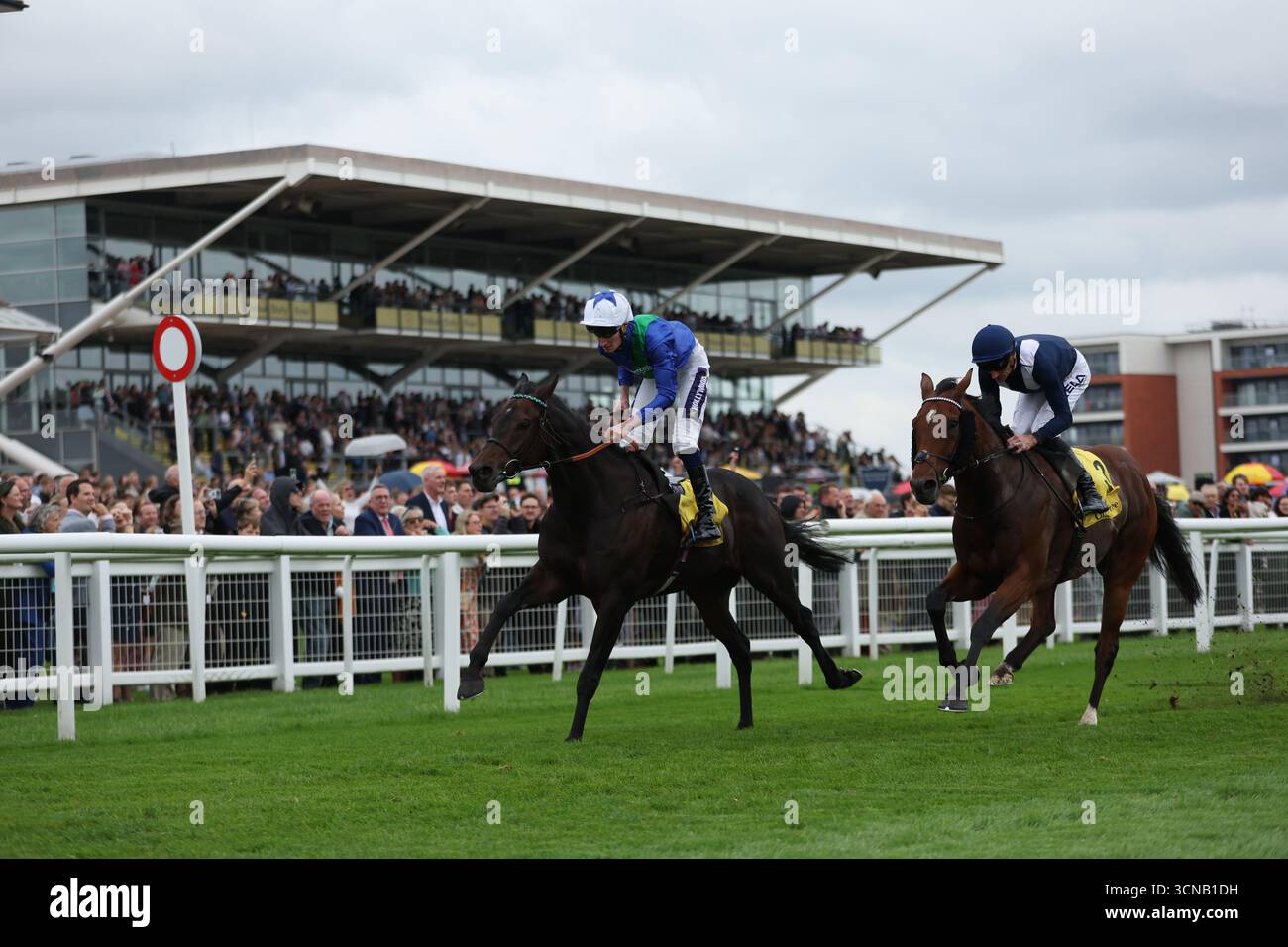 Mustazeed ridden by Daniel Muscutt (left) wins the Dubai Duty Free ...