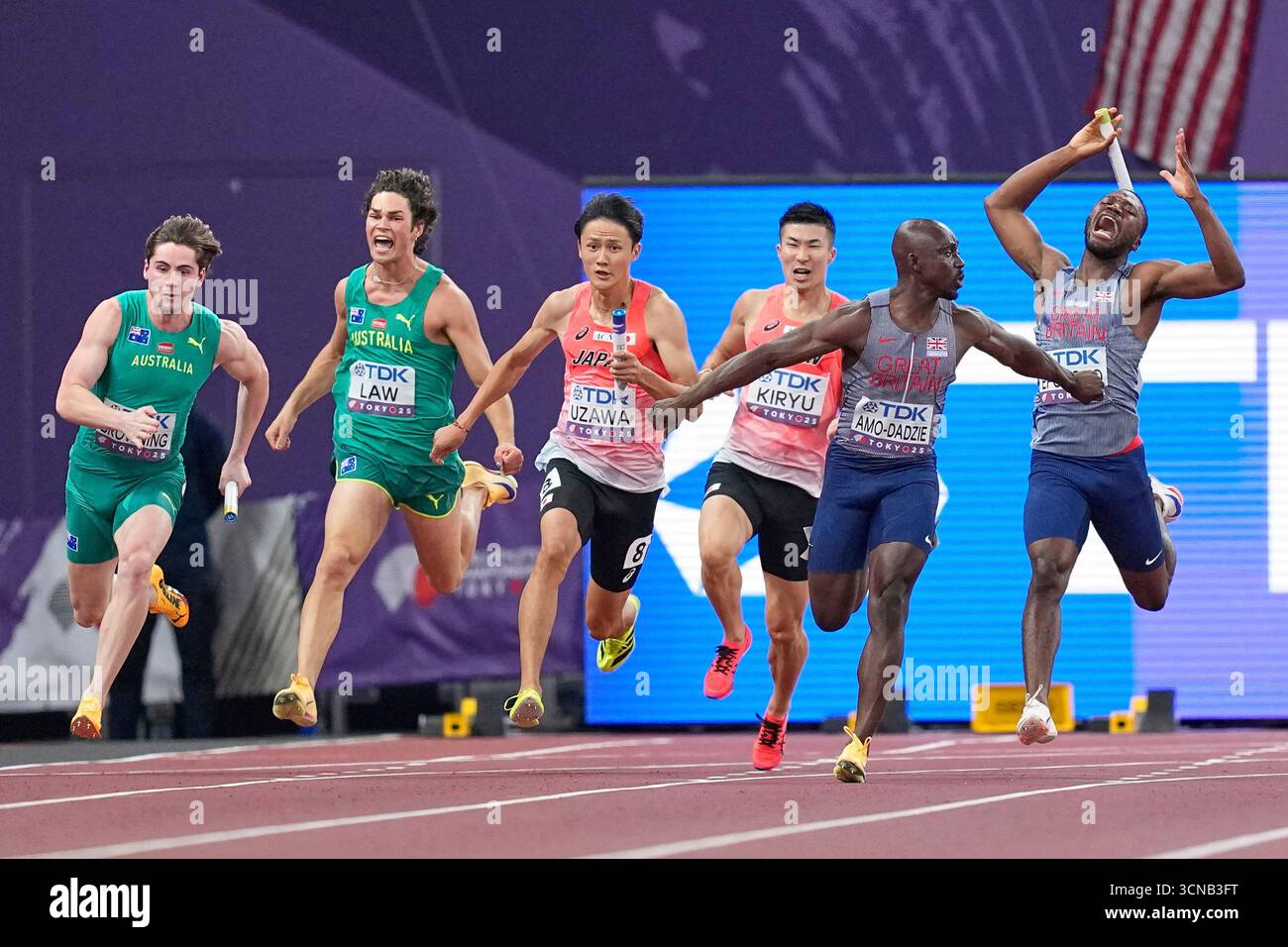 Britain's Jona Efoloko reacts as he fails to hand the baton in time to ...