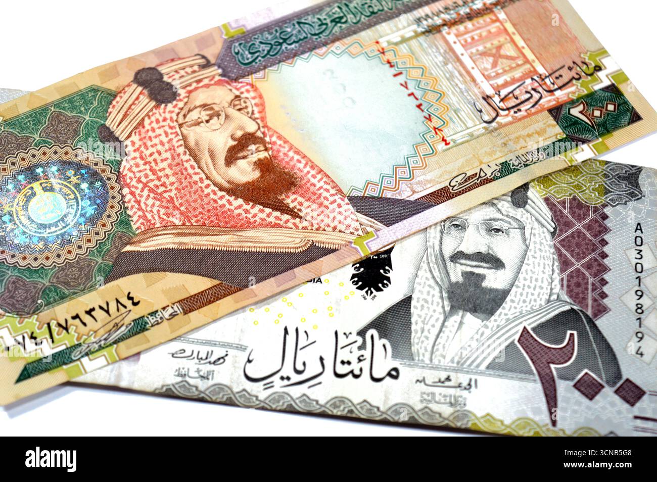 The obverse sides of old and new 200 SAR two hundred Saudi Arabia riyal ...