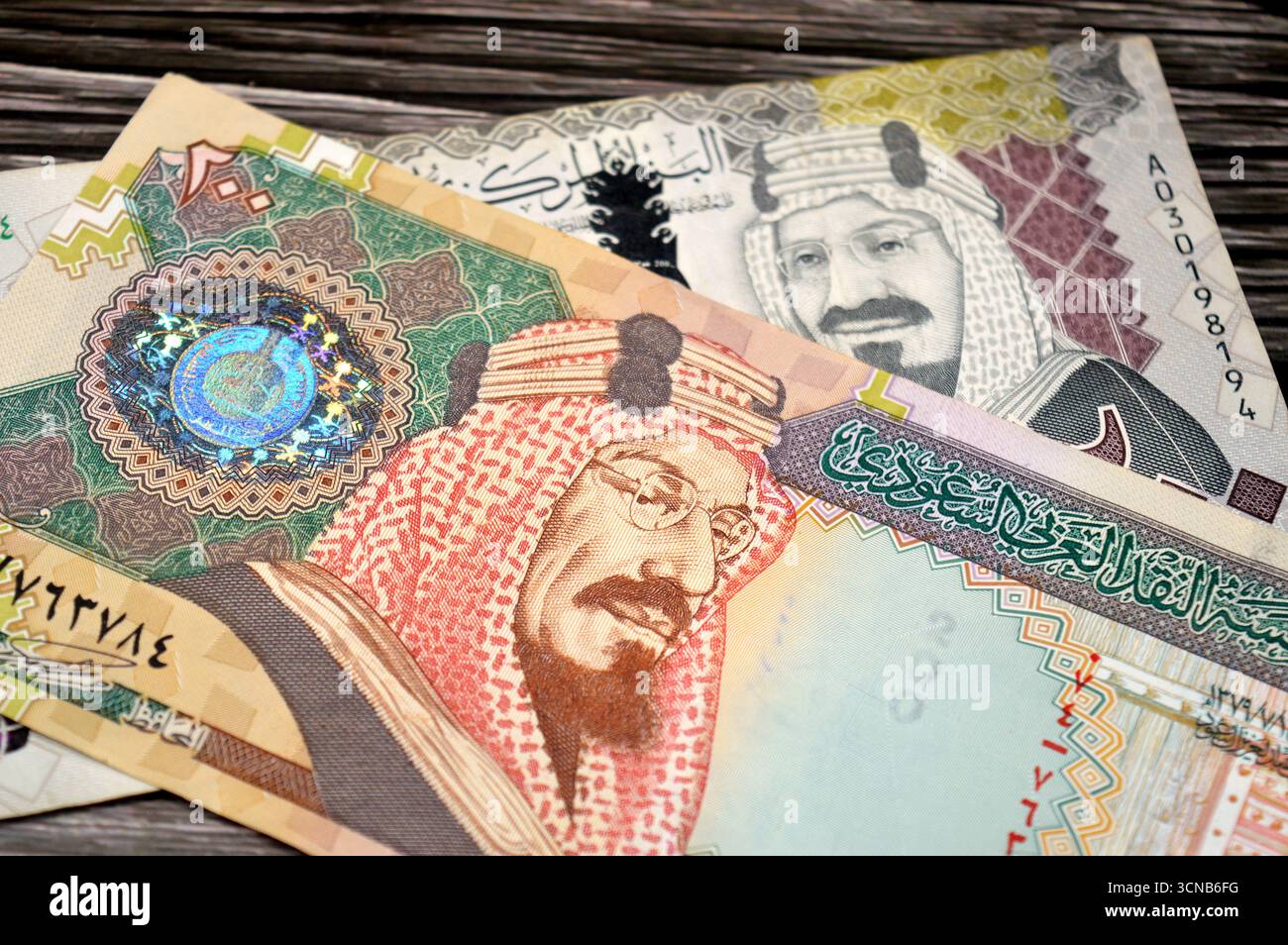The obverse sides of old and new 200 SAR two hundred Saudi Arabia riyal ...