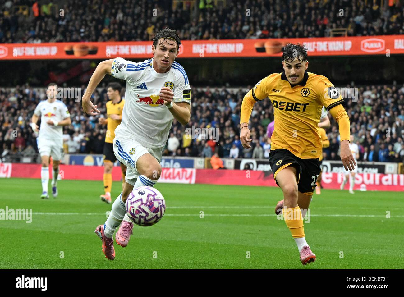 Leeds United's Brenden Aaronson (left) and Wolverhampton Wanderers ...