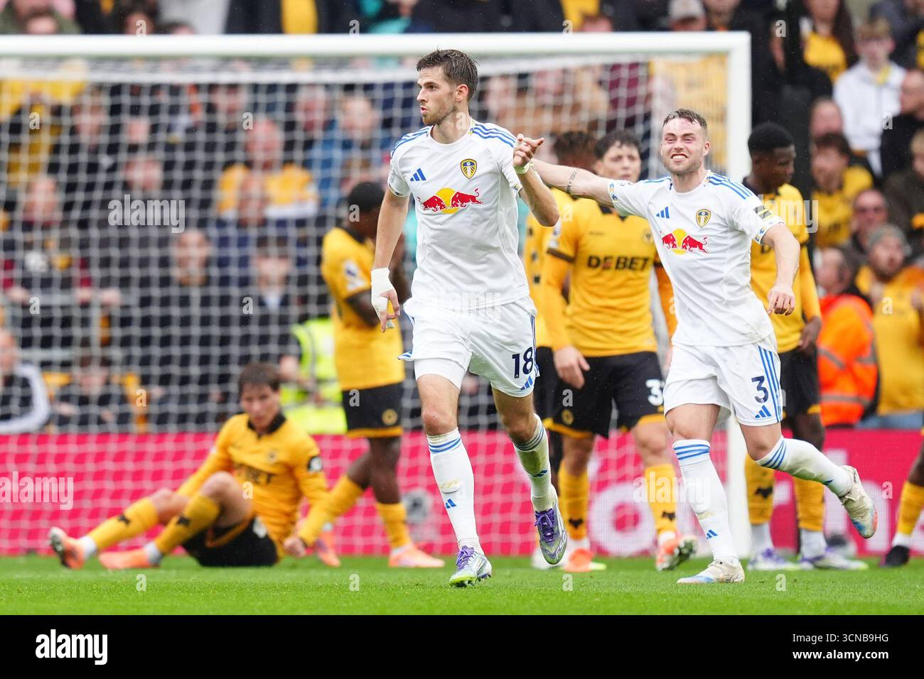 Leeds United's Anton Stach (left) celebrates scoring their side's ...
