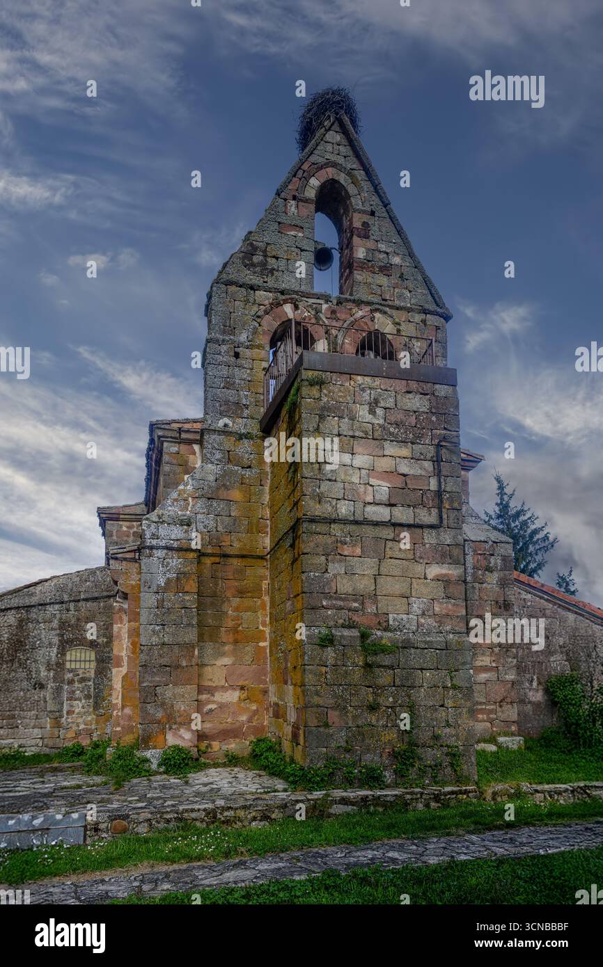 Ancient stone bell gable with stork nest and rustic walls in a Spanish ...