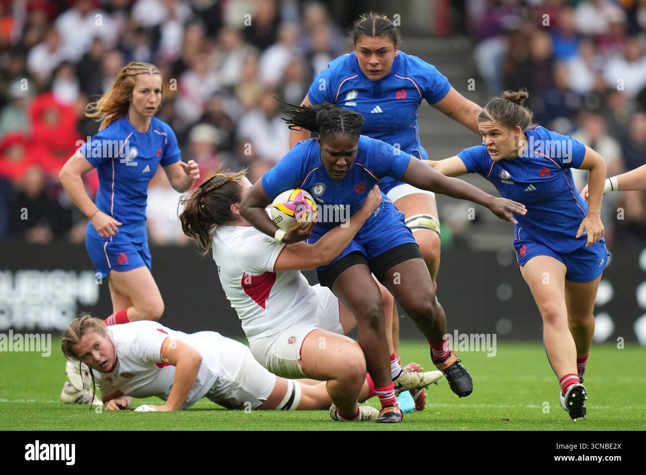 France's Yllana Brosseau is tackled by England's Maud Muir during the ...