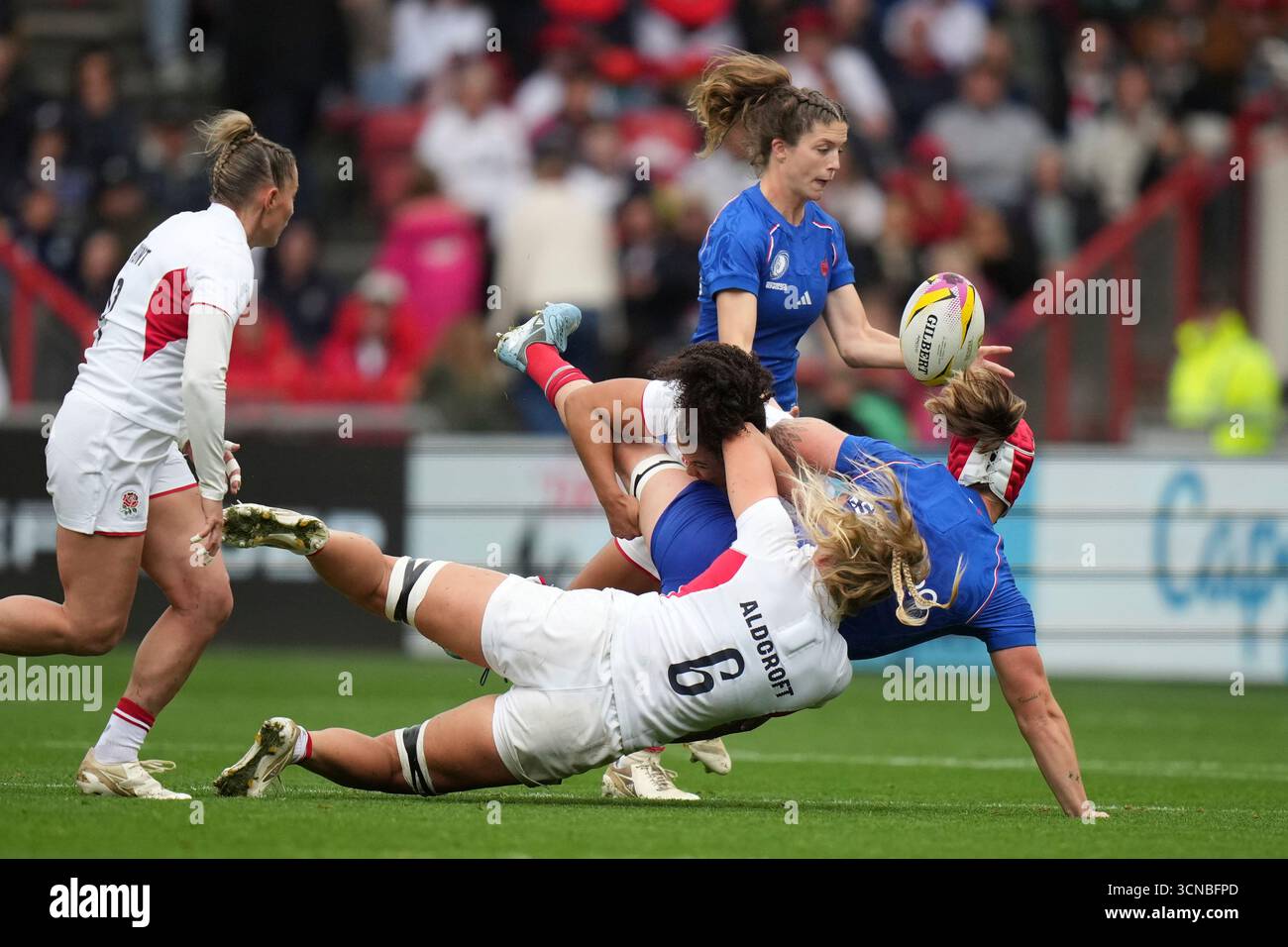 France's Morgane Bourgeois catches the ball as England's Zoe Aldcroft ...