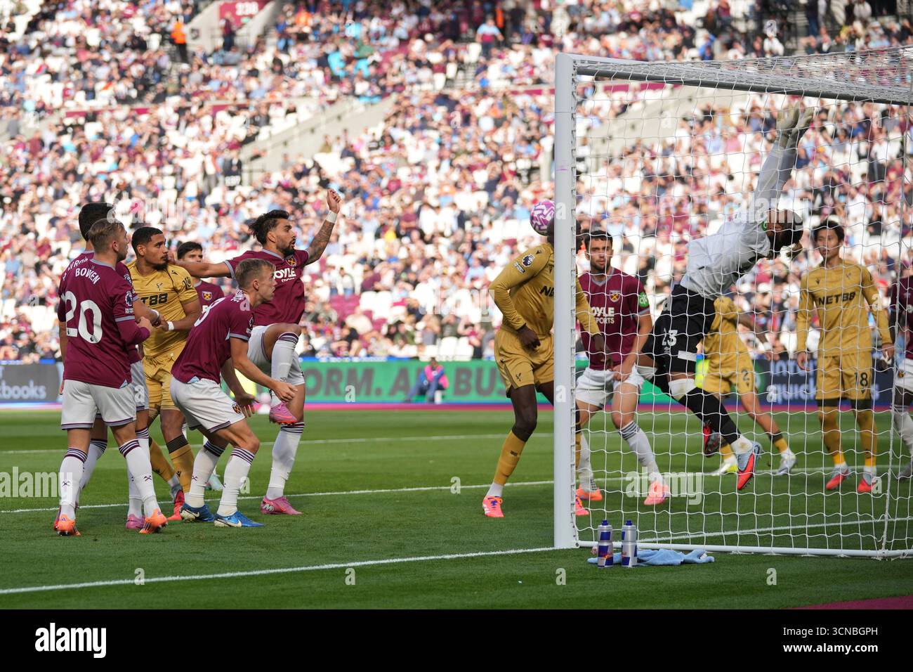 West Ham's goalkeeper Alphonse Areola, right, makes a save during the ...