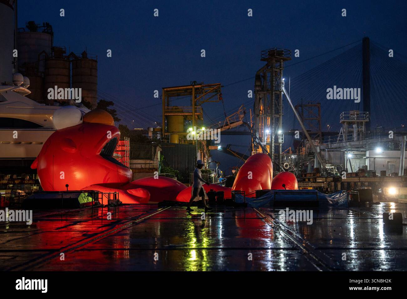 Hong Kong Water Parade at Victoria Harbor Media Event A worker walks ...
