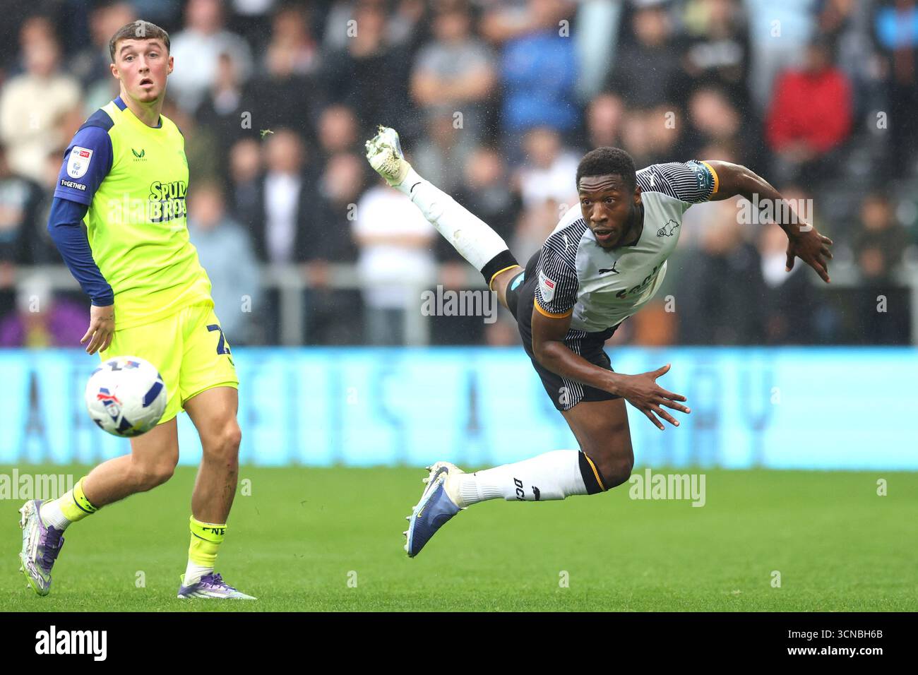 Derby County's Ebou Adams (right) and Preston North End's Alfie Devine ...