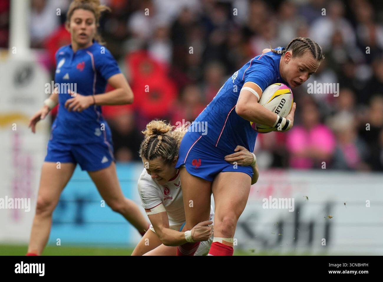 France's Marine Menager is tackled by England's Ellie Kildunne during ...