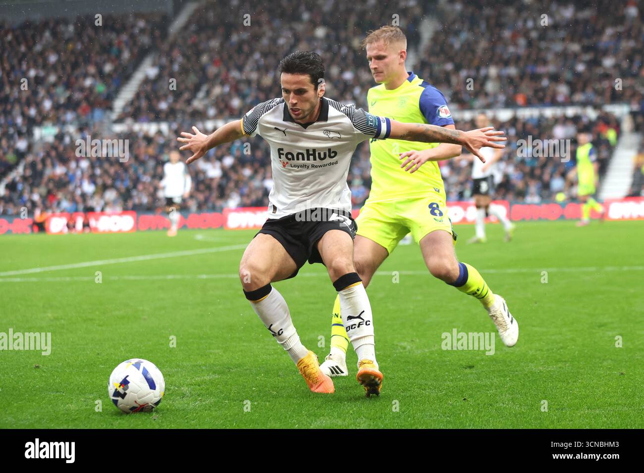 Derby County's Lewis Travis (left) and Preston North End's Ali McCann ...