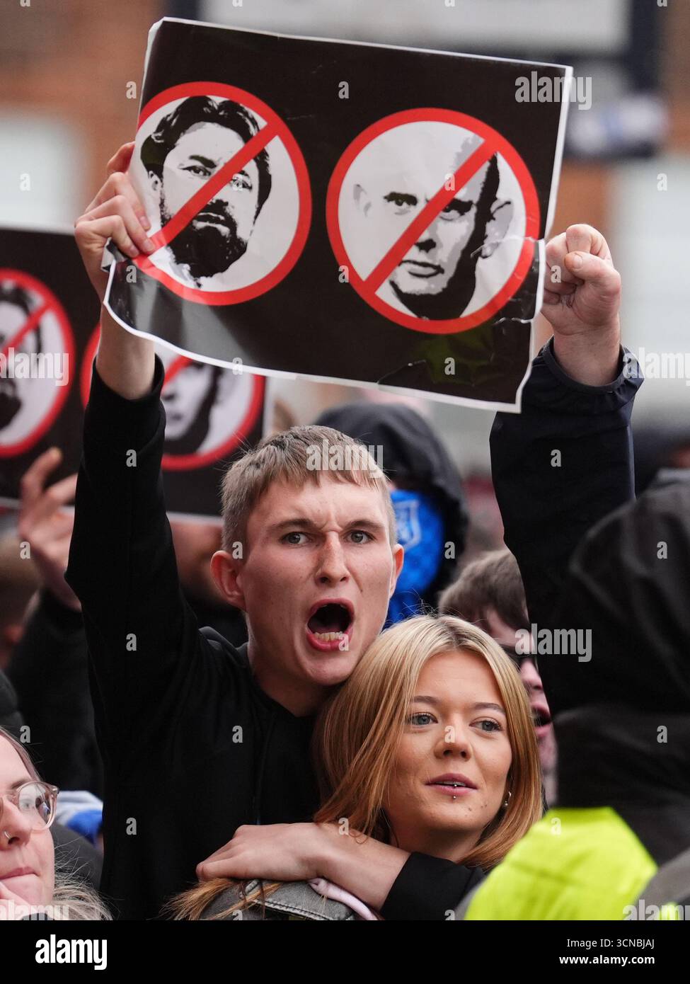 Campaigners hold signs opposing Rangers head coach Russell Martin and ...