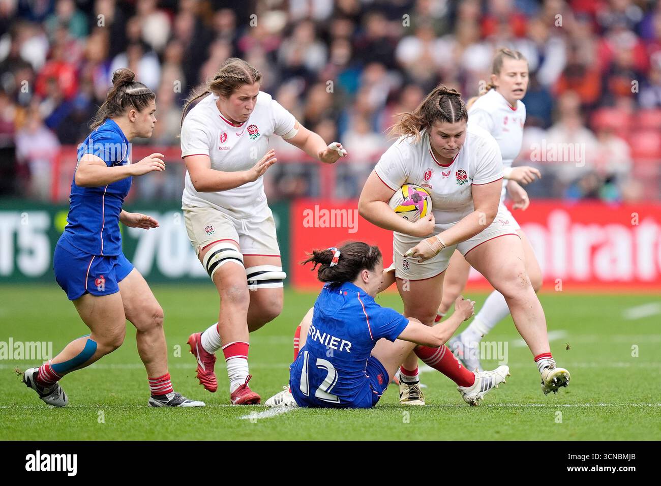 England's Maud Muir (right) is tackled by France's Gaby Vernier during ...