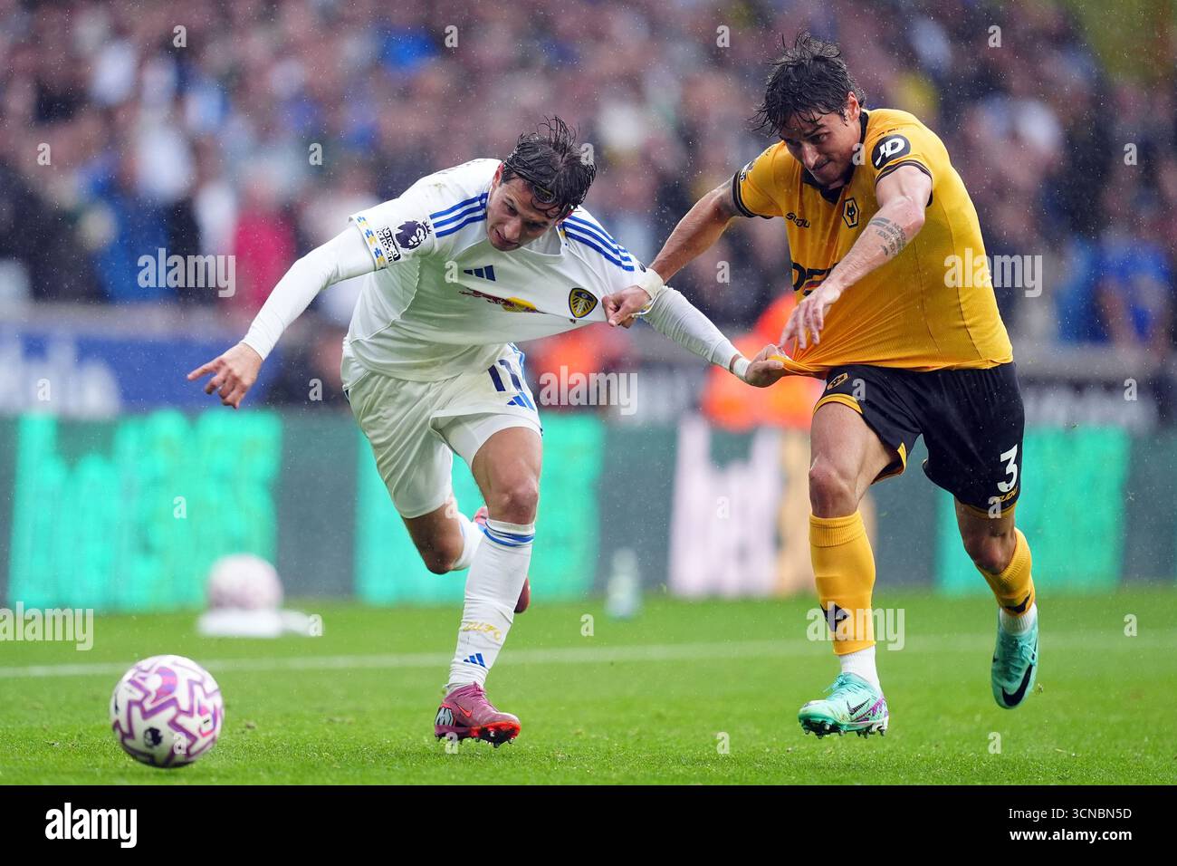 Wolverhampton Wanderers' Hugo Bueno (left) and Leeds United's Brenden ...