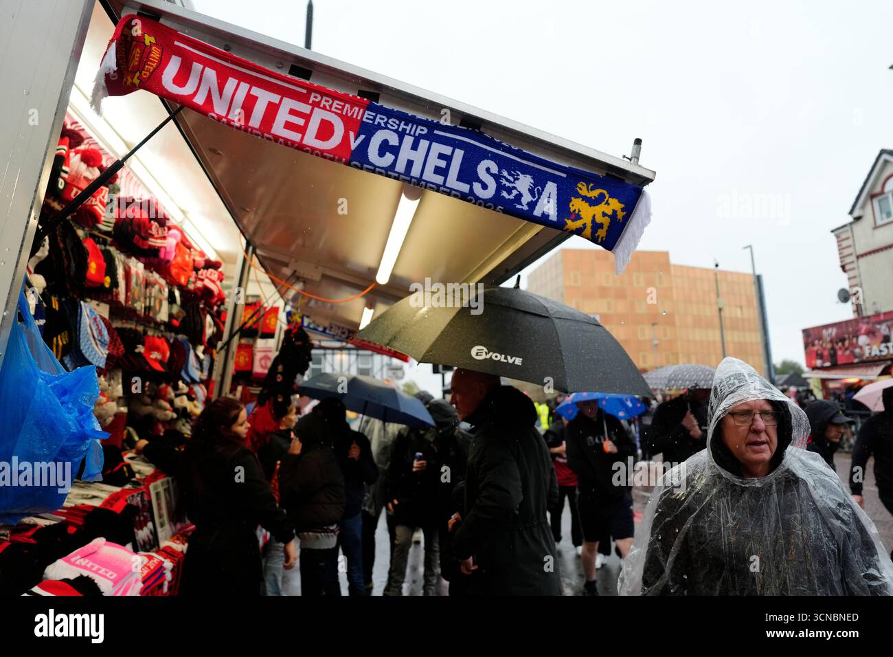 Fans at a merchandise stall outside the ground ahead of the Premier ...