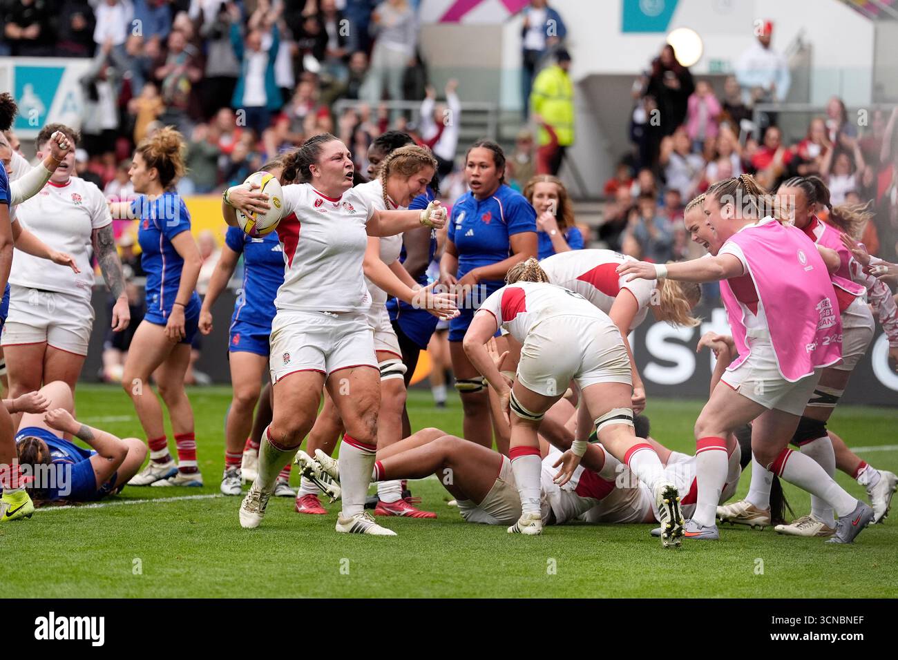 England's Amy Cokayne (centre left) celebrates scoring a try during the ...