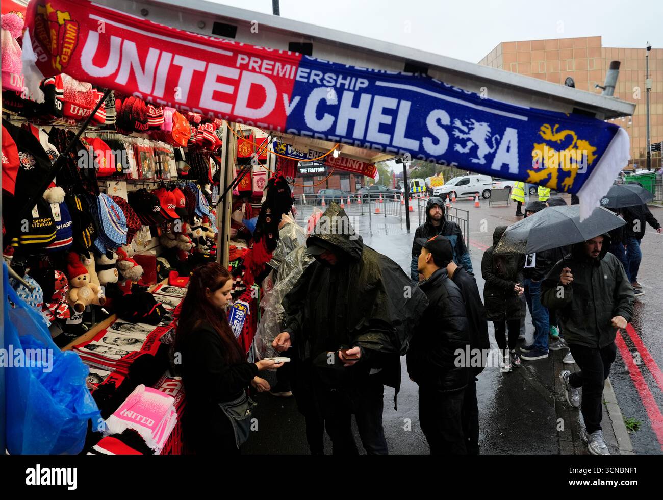 Fans at a merchandise stall outside the ground ahead of the Premier ...