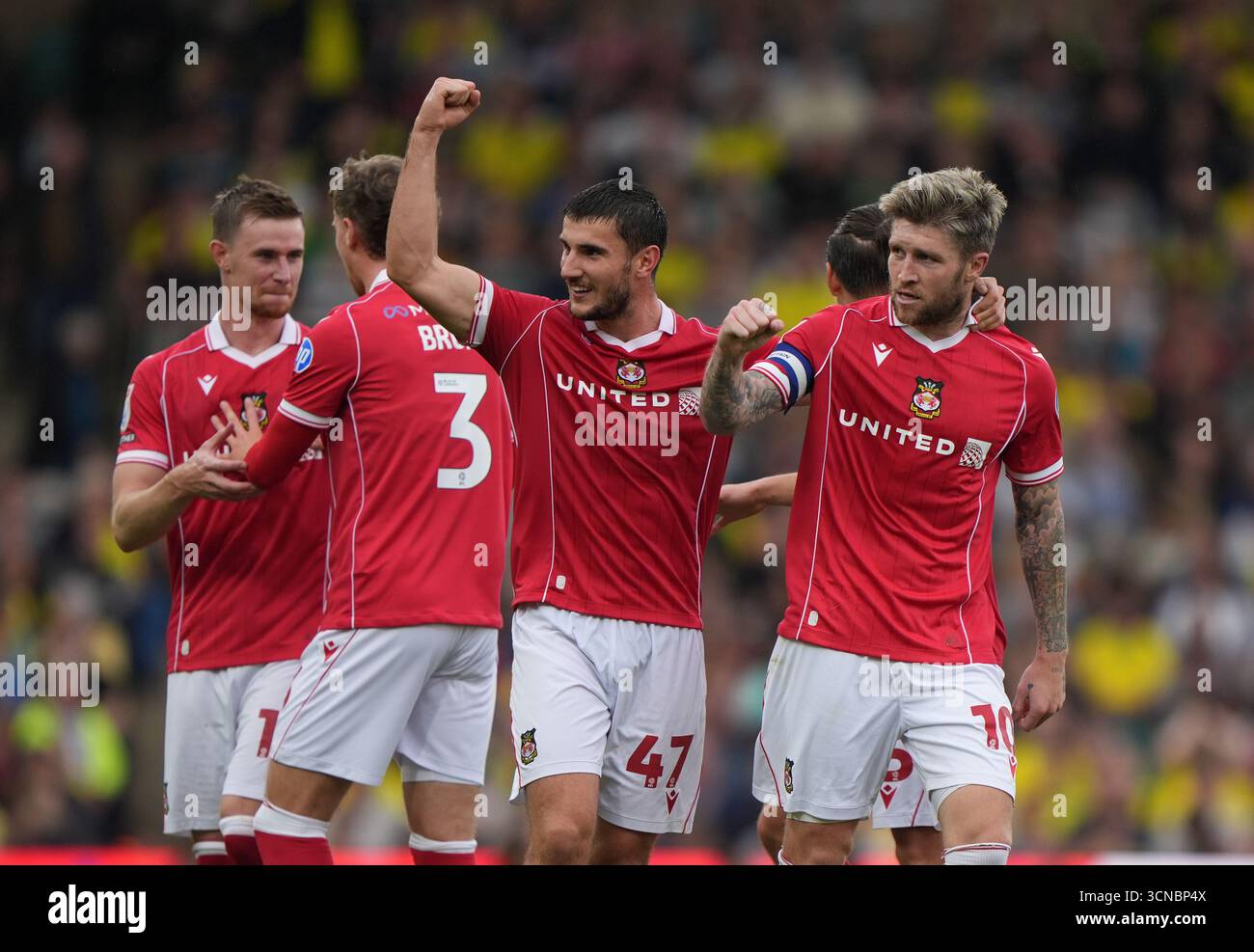 Wrexham's Josh Windass (right) celebrates scoring their side's third ...