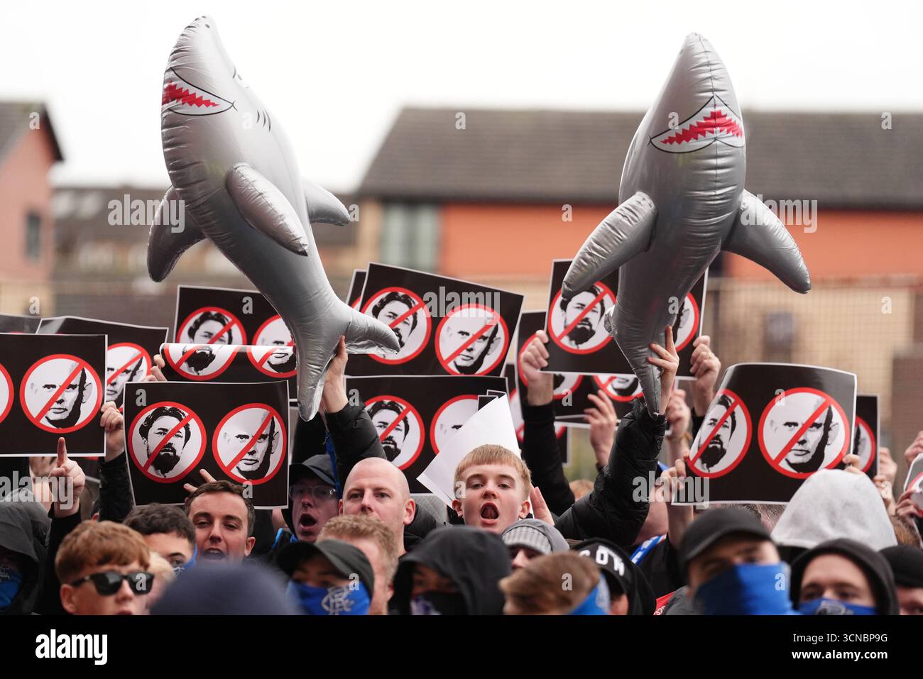 Campaigners hold signs opposing Rangers head coach Russell Martin and ...
