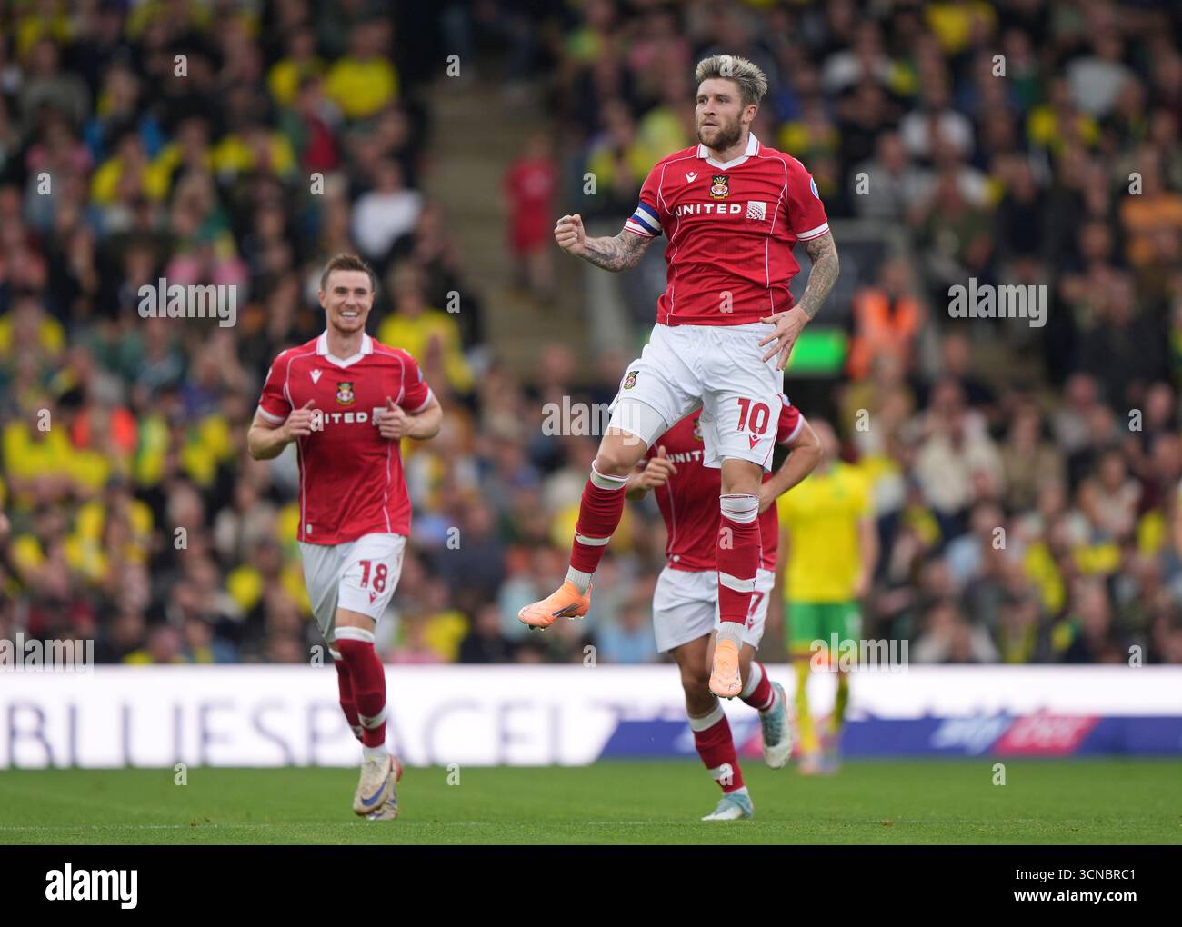 Wrexham's Josh Windass celebrates scoring their side's third goal of ...