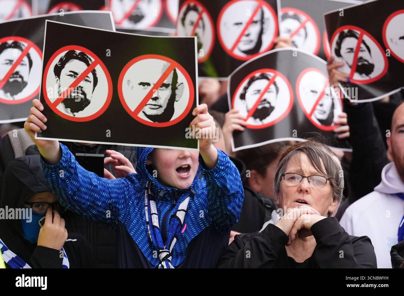 Campaigners hold signs opposing Rangers head coach Russell Martin and ...