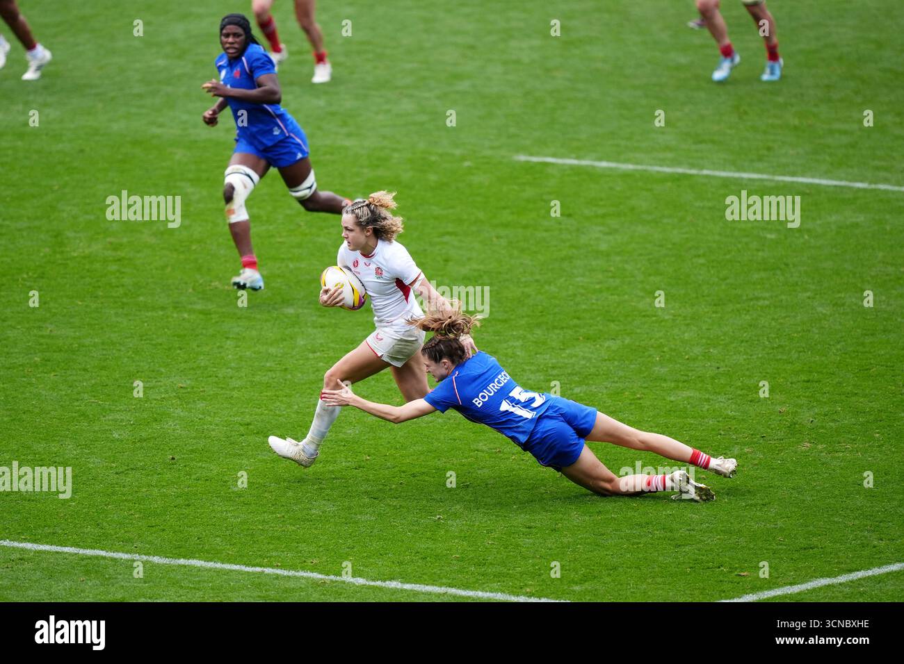 England's Ellie Kildunne goes past France's Morgane Bourgeois before ...