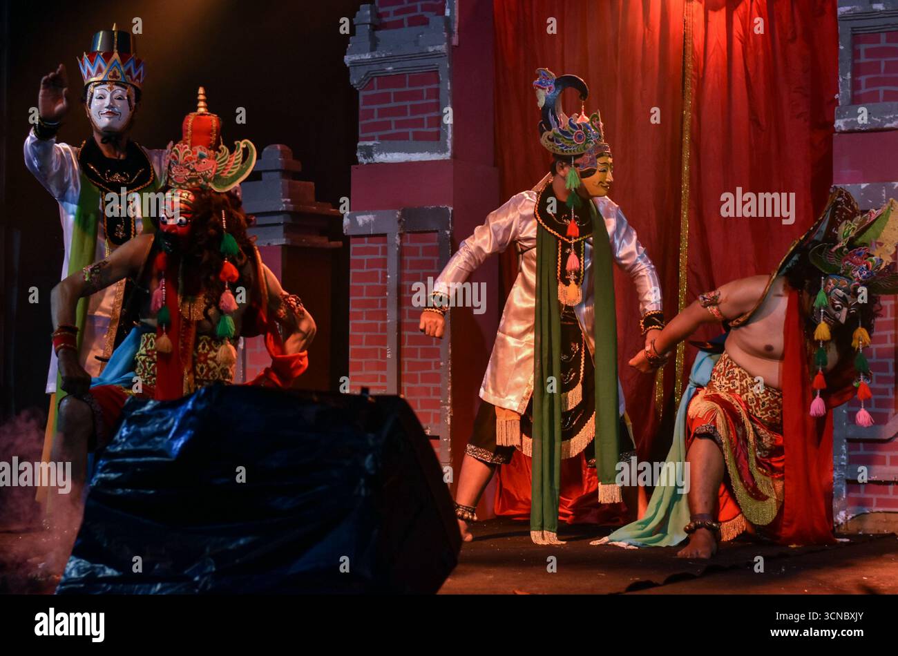 Performers showcase their dancing and acting skills in a human puppet ...