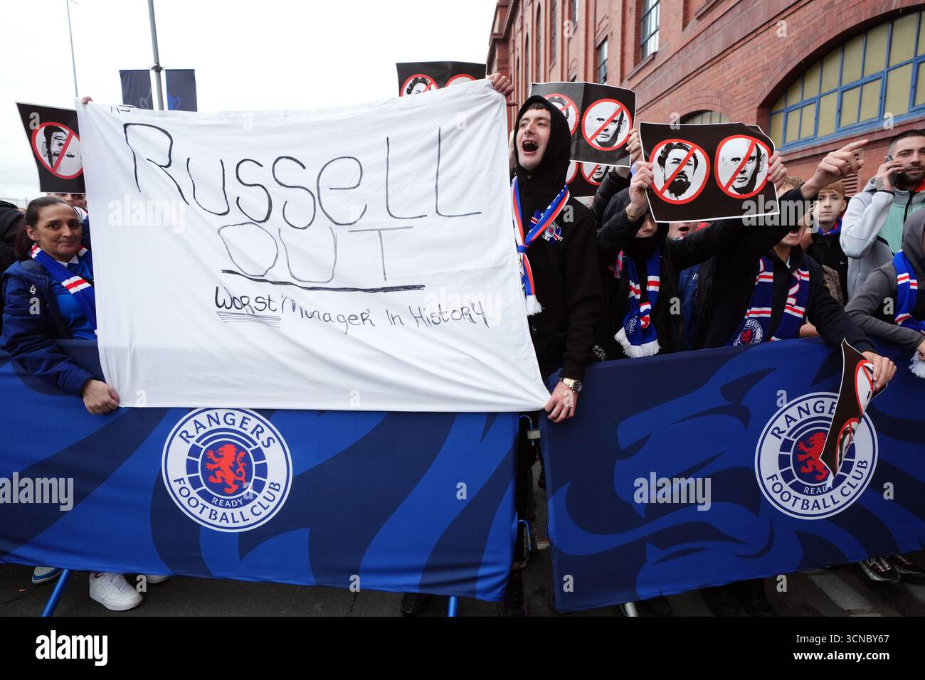 Rangers fans hold signs and banners during a protest organised by ...