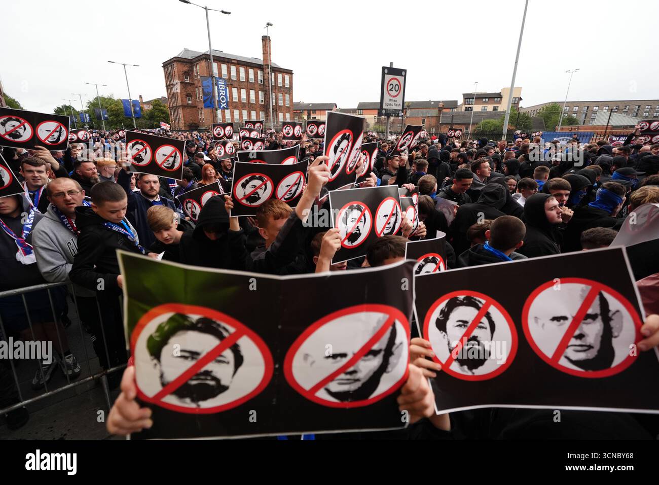 Rangers fans hold signs and banners during a protest organised by ...