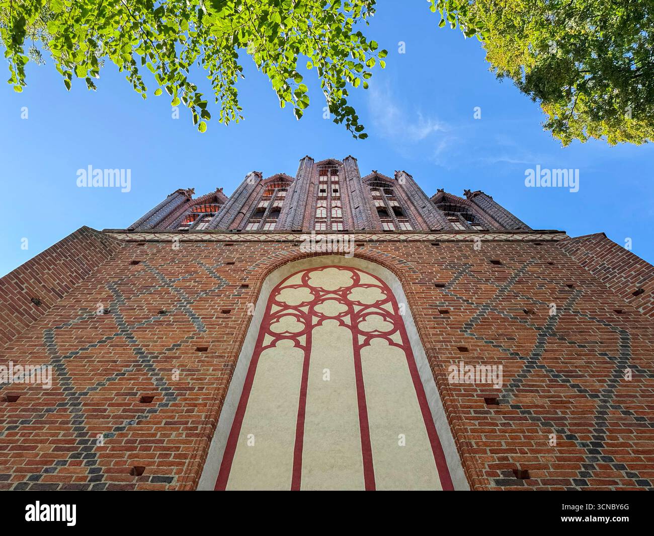 Front facade of gothic brick catholic church built in 1370 in Europe ...