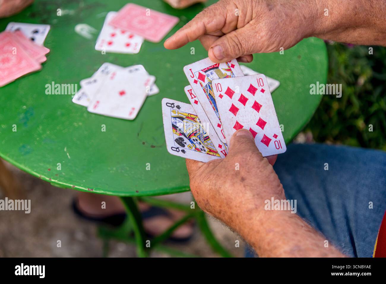 Hand playing cards table hi-res stock photography and images - Alamy