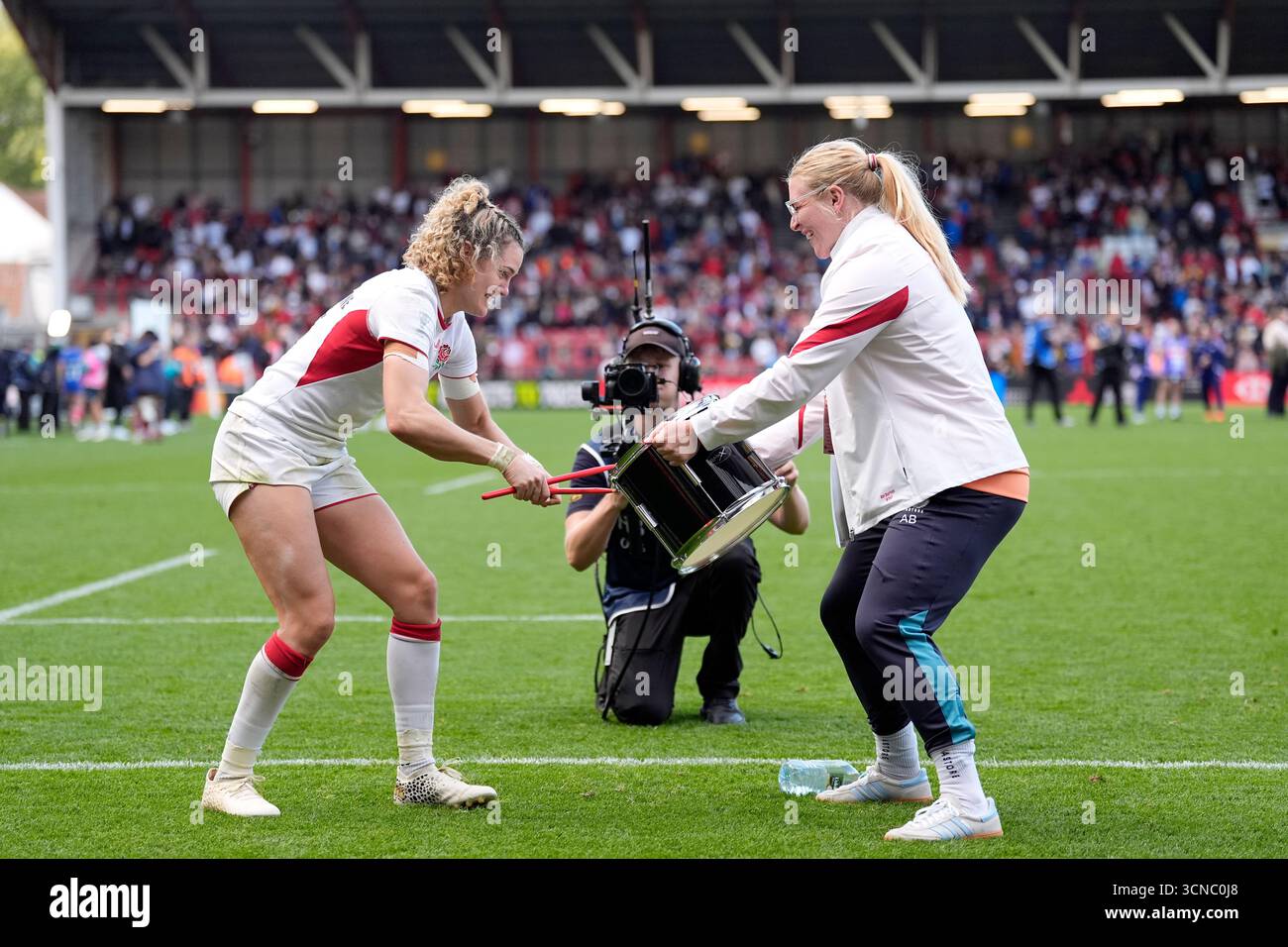 England's Ellie Kildunne plays the drums as she celebrates after the ...