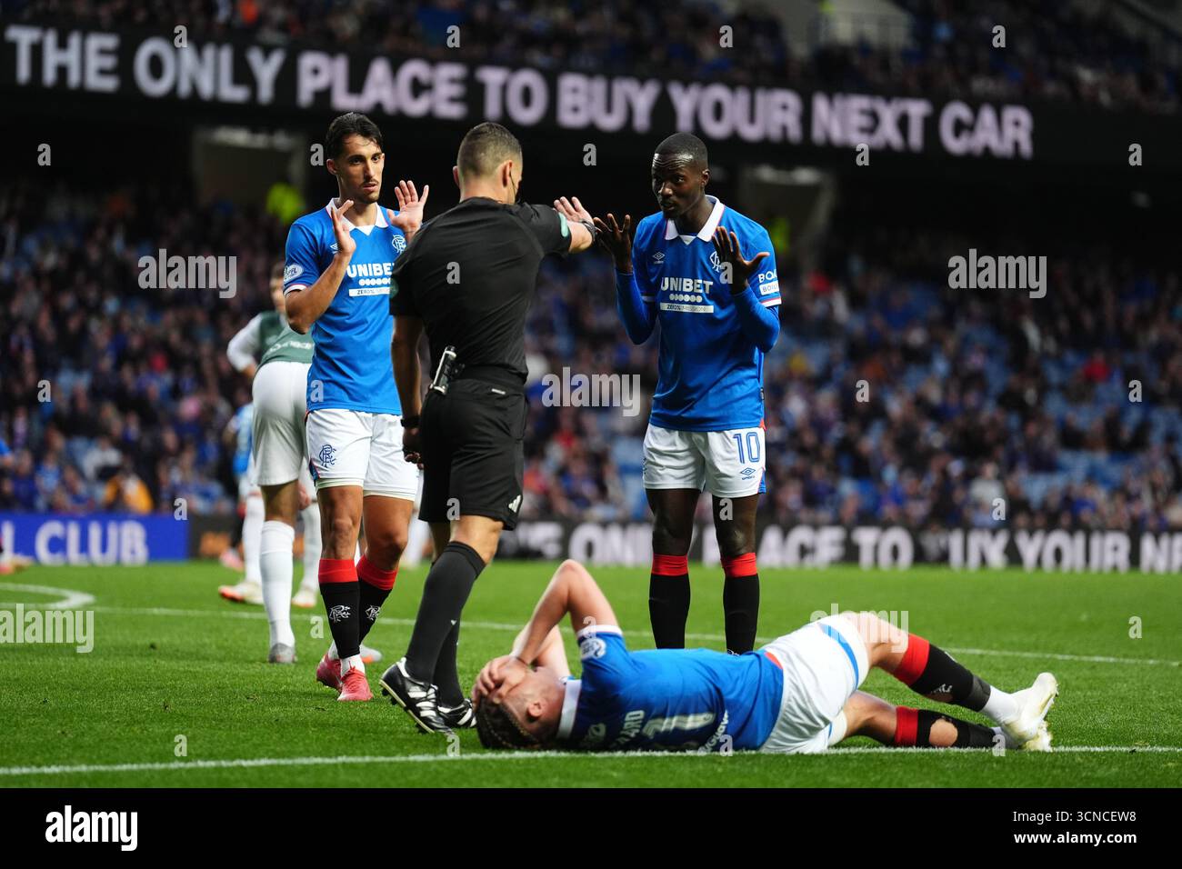 Rangers’ Thelo Aasgaard (centre) lays on the floor injured during the ...