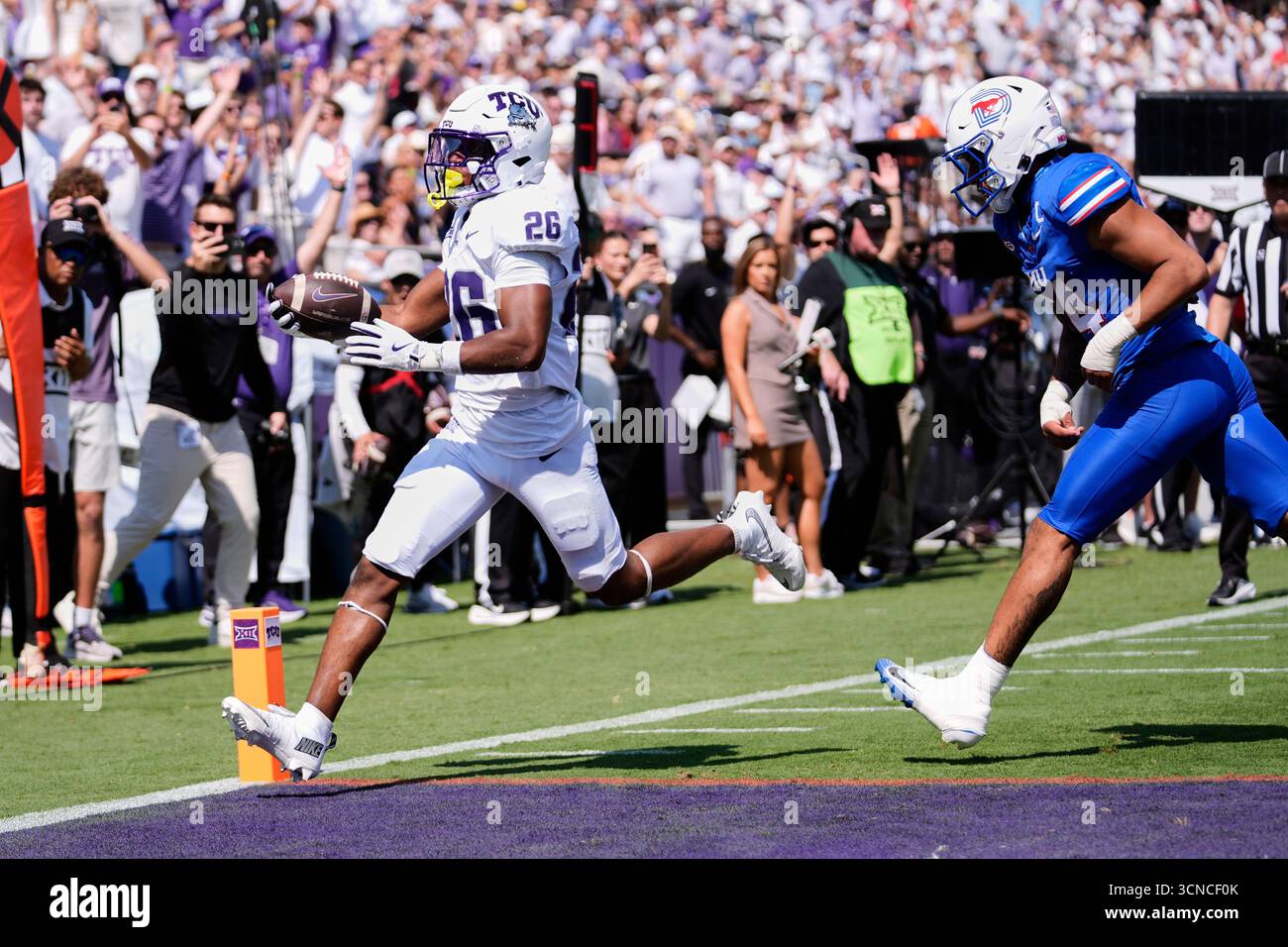 TCU running back Jeremy Payne (26) reaches the end zone for a touchdown ...