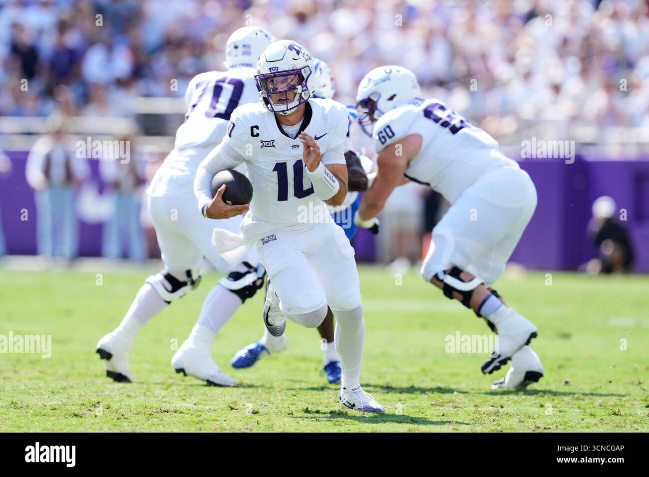 TCU quarterback Josh Hoover (10) keeps the ball and runs it for a gain ...