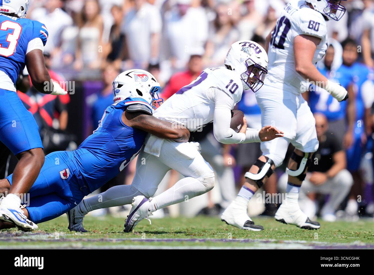 TCU quarterback Josh Hoover (10) is sacked by SMU defensive end Cameron ...