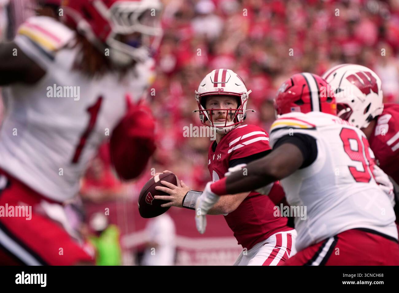 Wisconsin quarterback Billy Edwards Jr. looks to pass during the first ...
