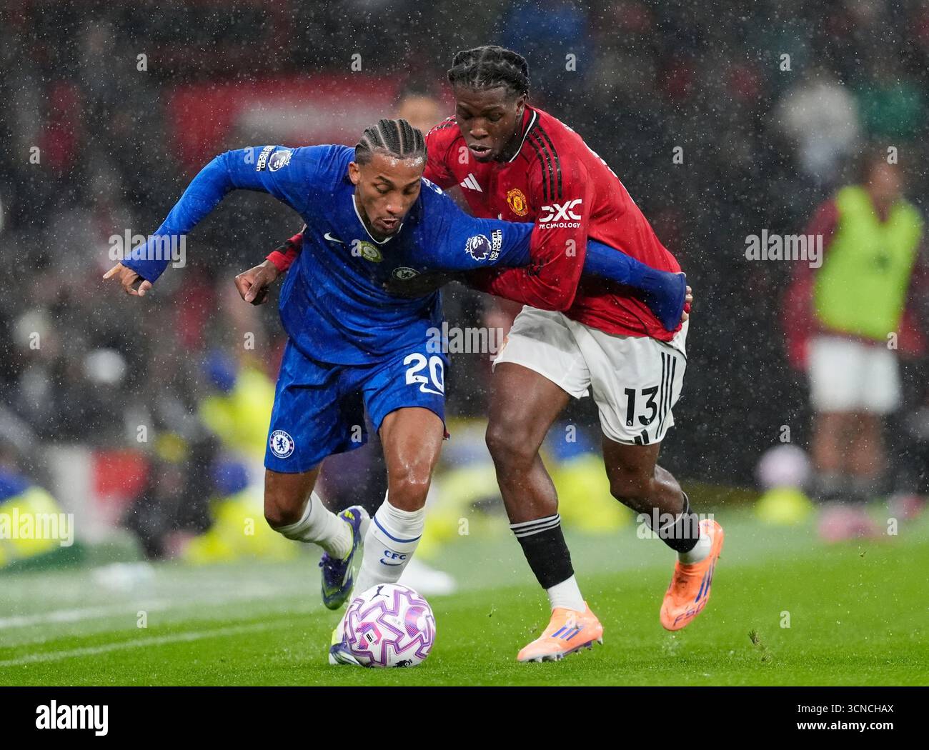 Chelsea's Joao Pedro (left) and Manchester United's Patrick Dorgu ...