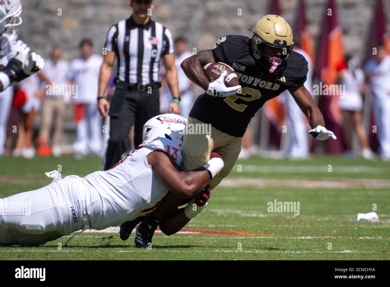 Virginia Tech defensive lineman Kemari Copeland (13) tackles Wofford ...