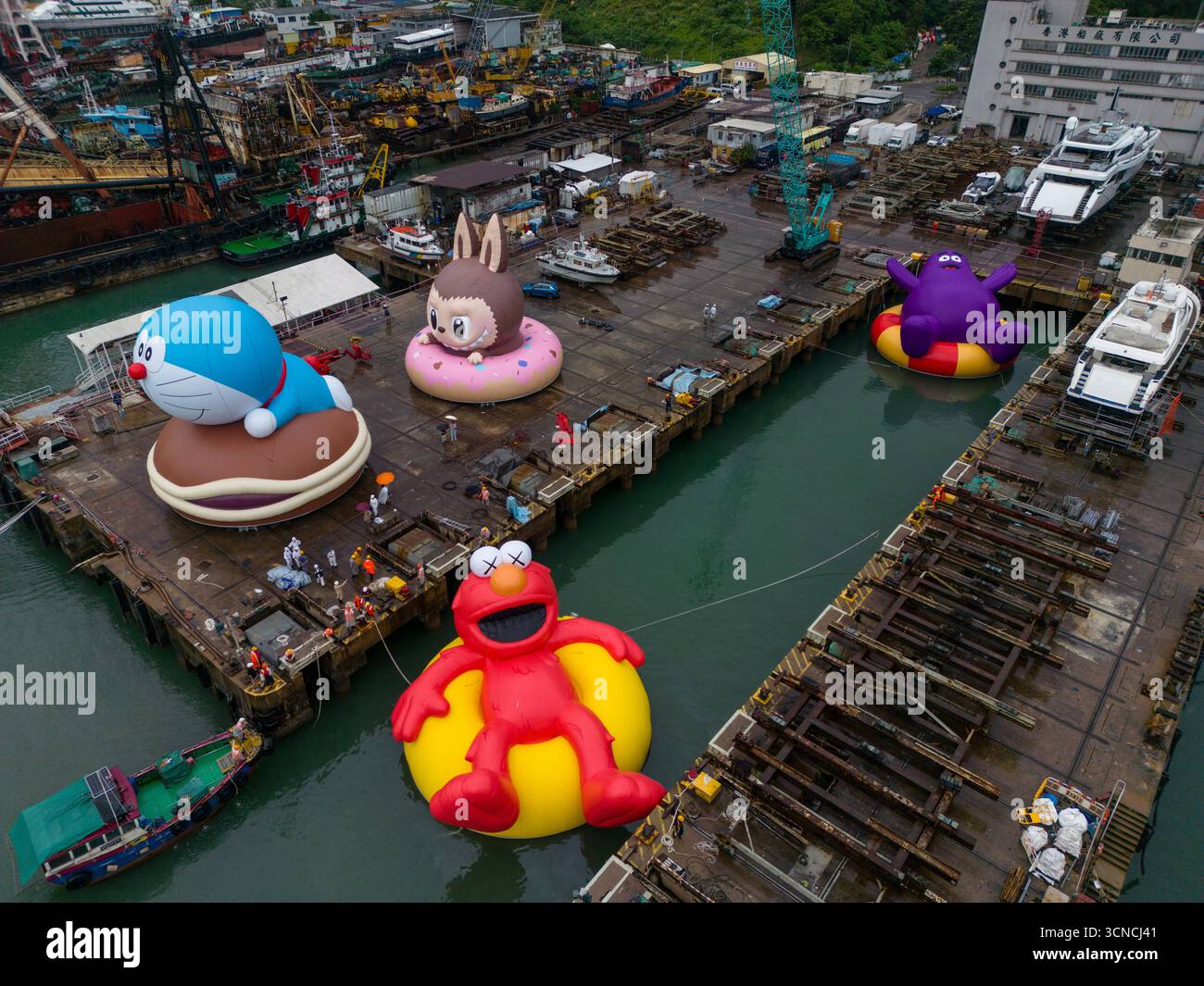 An aerial photograph showing large inflatable sculptures themed after ...