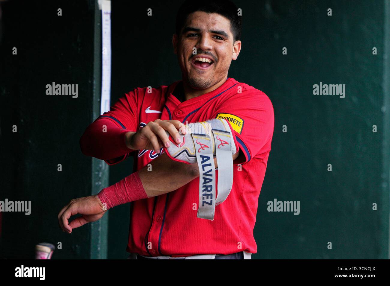 Atlanta Braves' Nacho Alvarez Jr. celebrates in the dugout after ...
