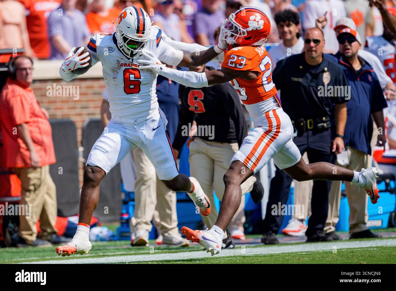 Clemson cornerback Ashton Hampton (23) tries to tackle Syracuse running ...