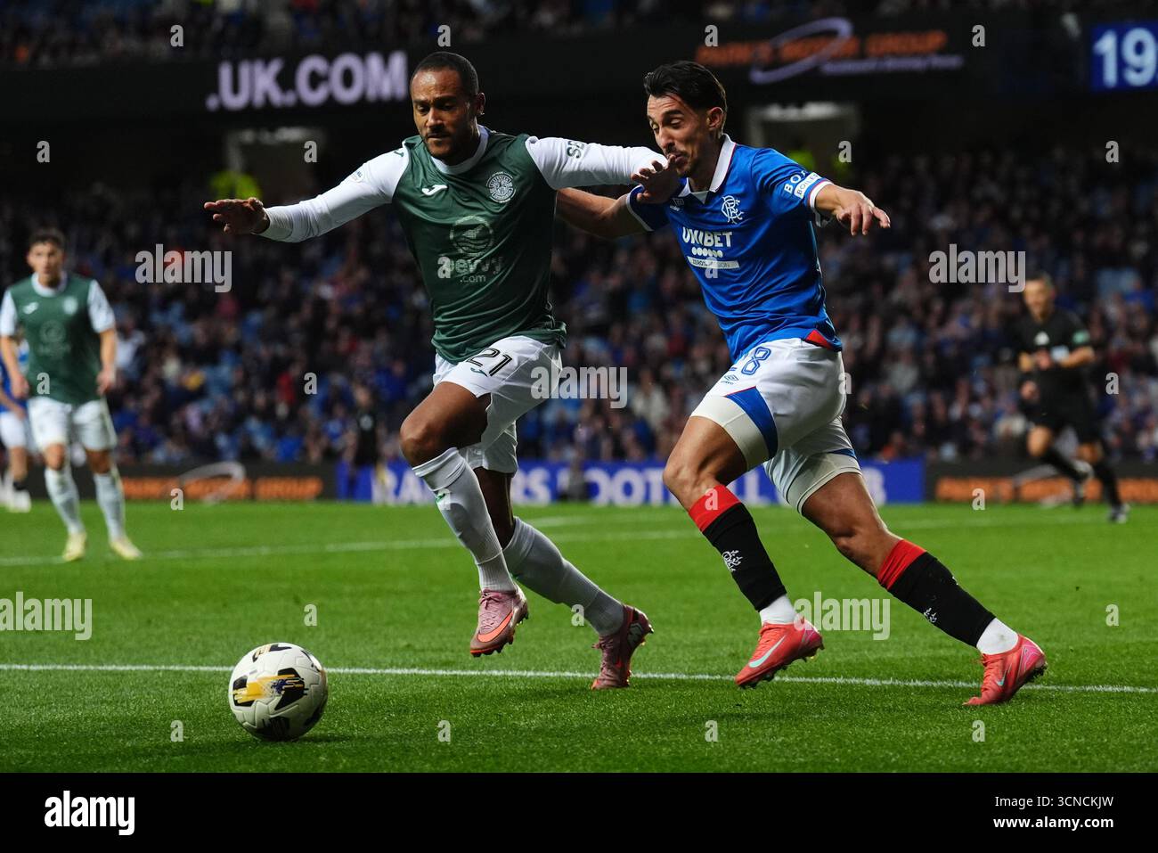 Hibernian's Jordan Obita (left) and Rangers’ Bojan Miovski battle for ...