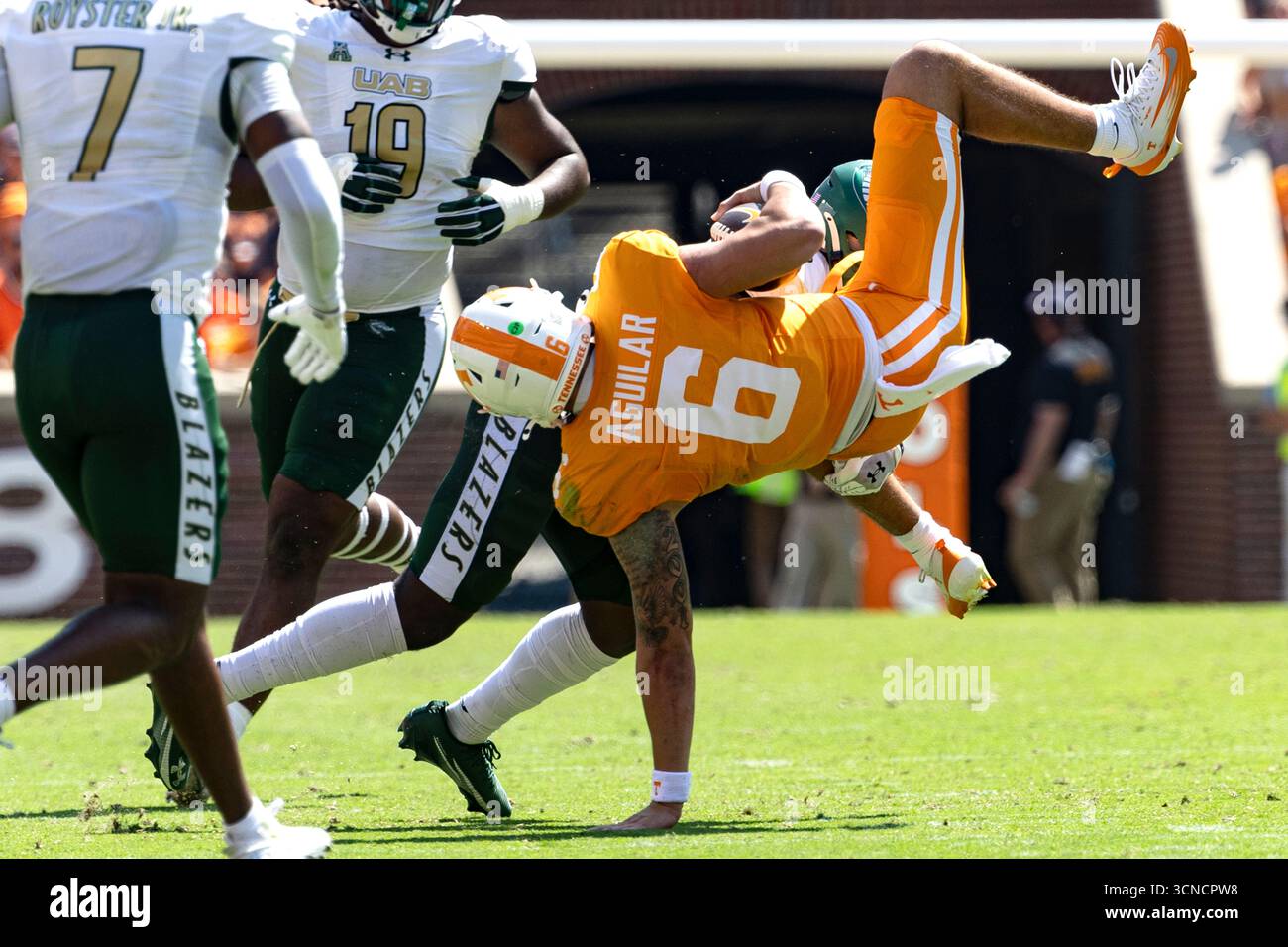Tennessee quarterback Joey Aguilar (6) is upended by a UAB defender ...