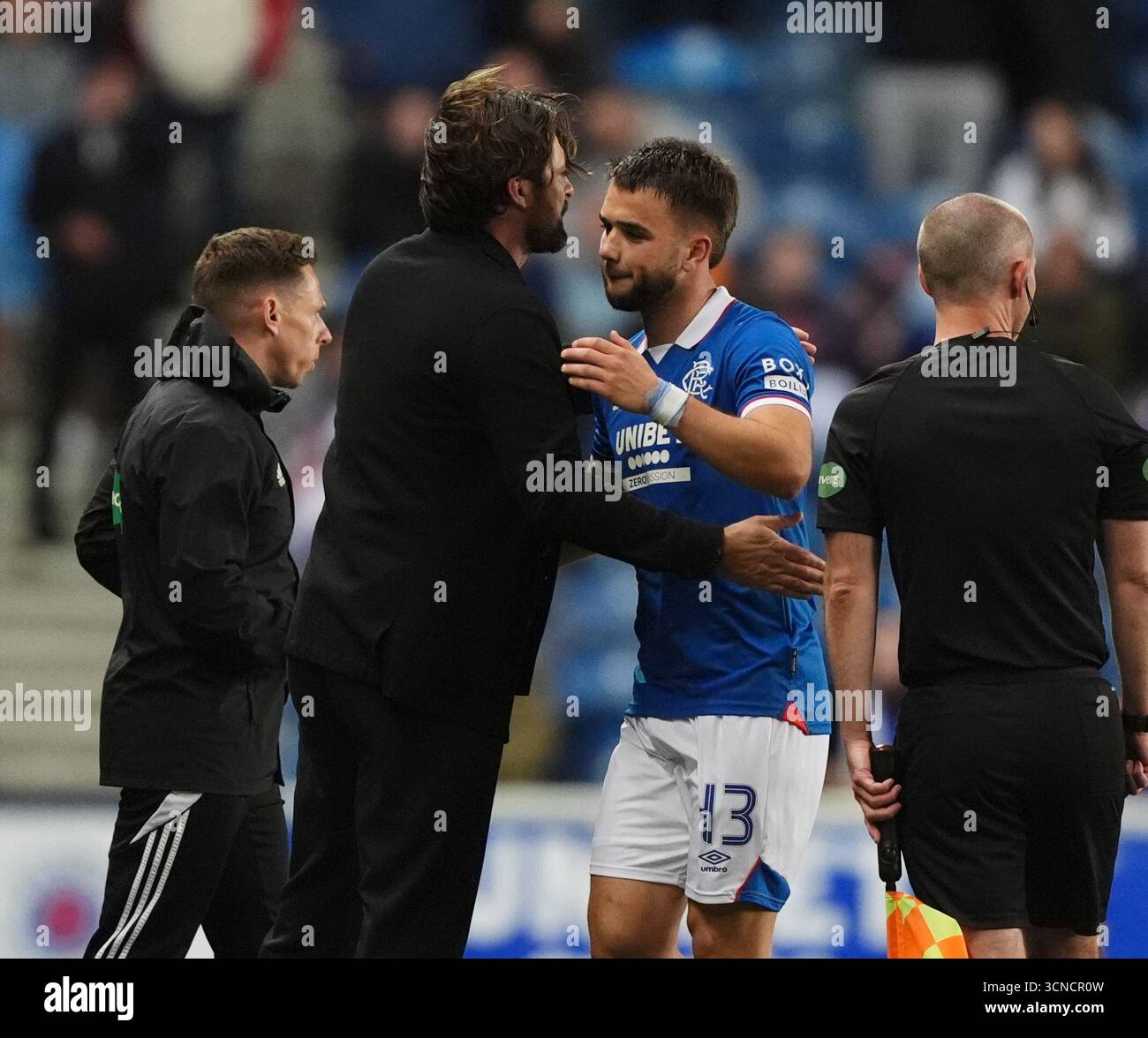 Rangers manager Russell Martin (left) and Rangers’ Nicolas Raskin ...