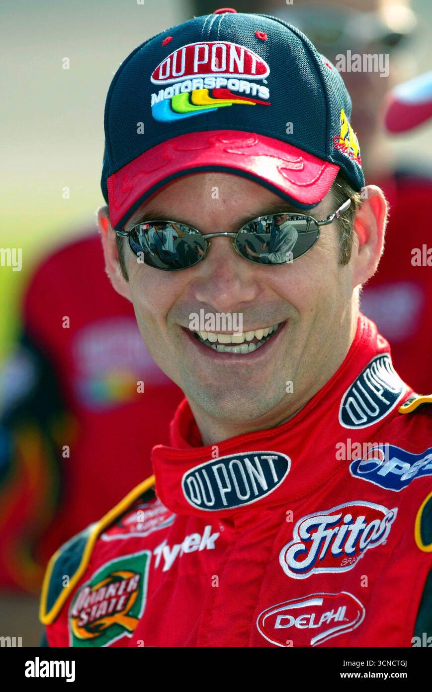 Jeff Gordon takes a moment to laugh with his crew during a practice ...