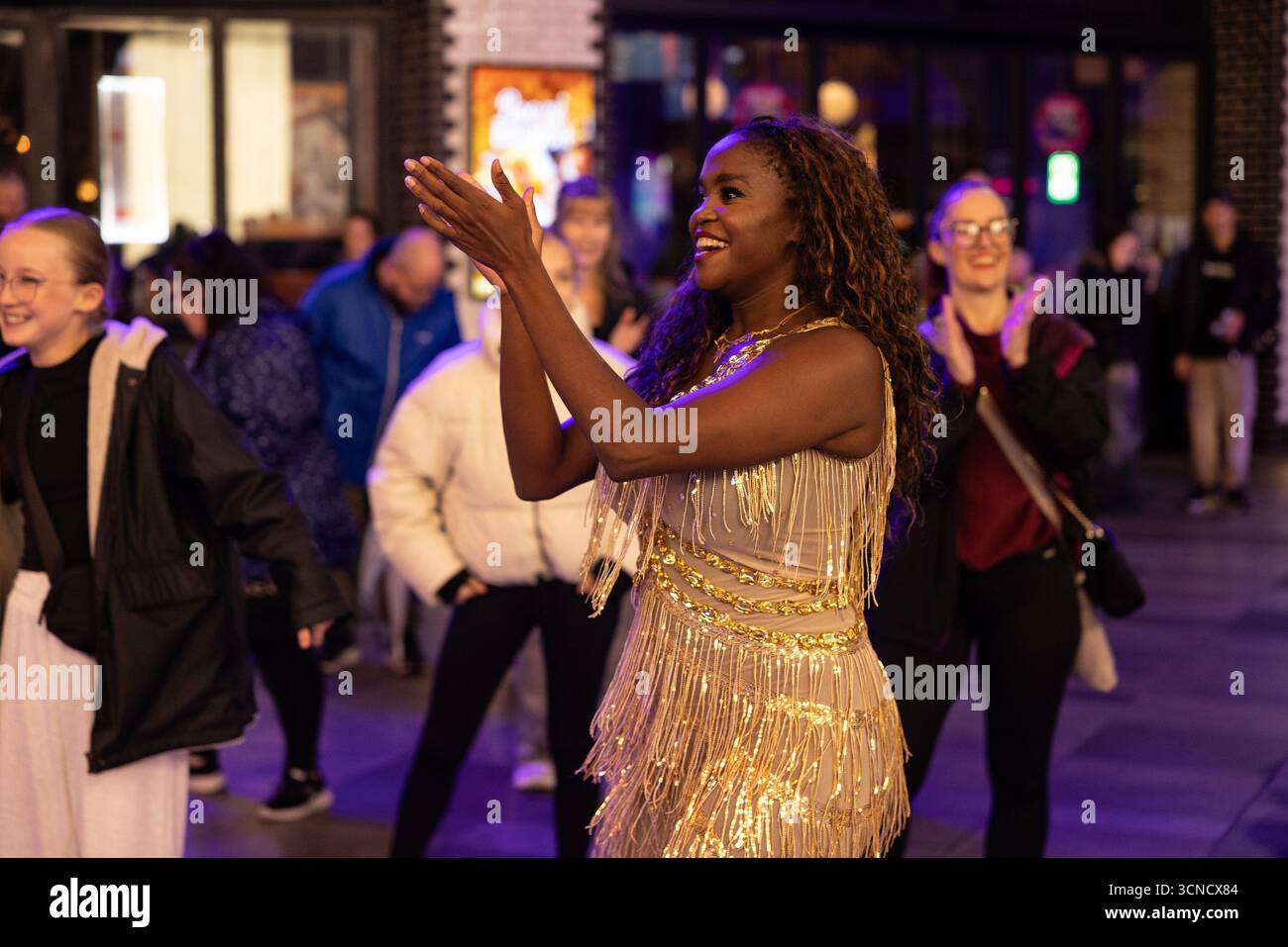 EDITORIAL USE ONLY Oti Mabuse leads a free family dance class at ...
