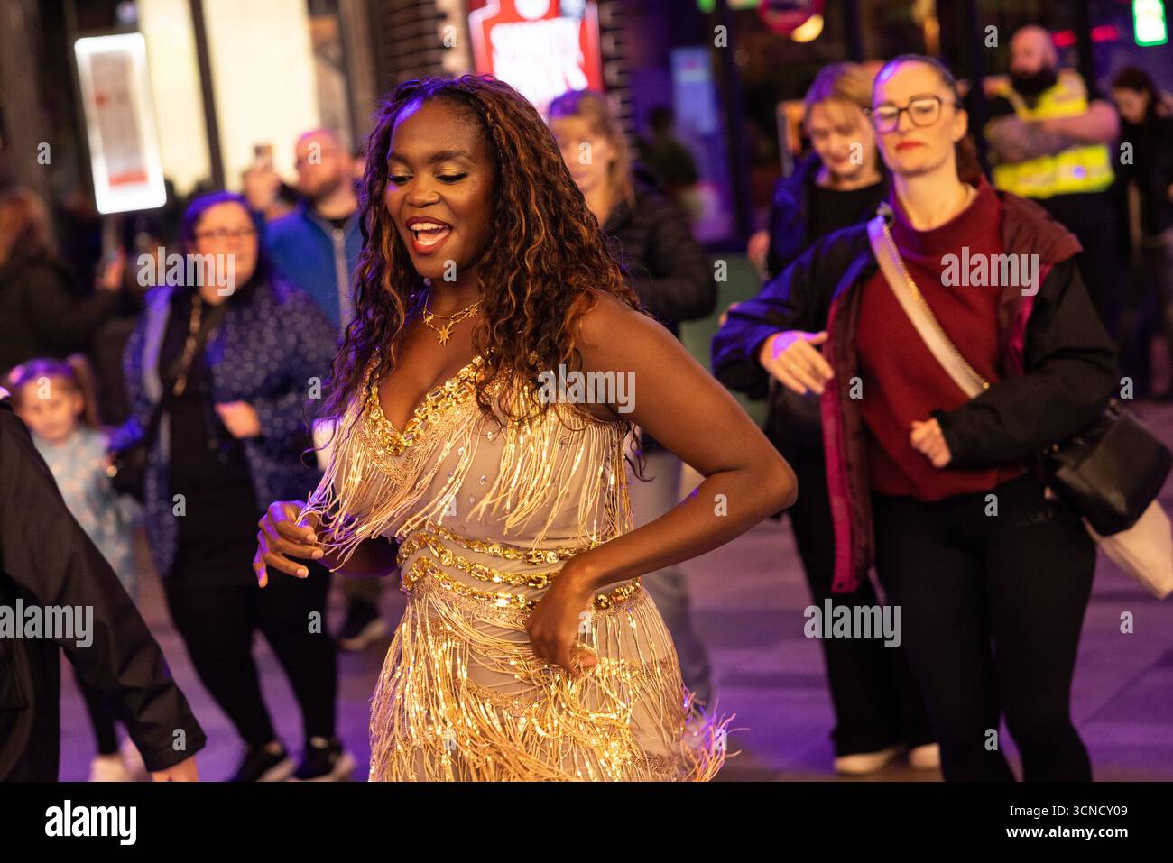 EDITORIAL USE ONLY Oti Mabuse leads a free family dance class at ...