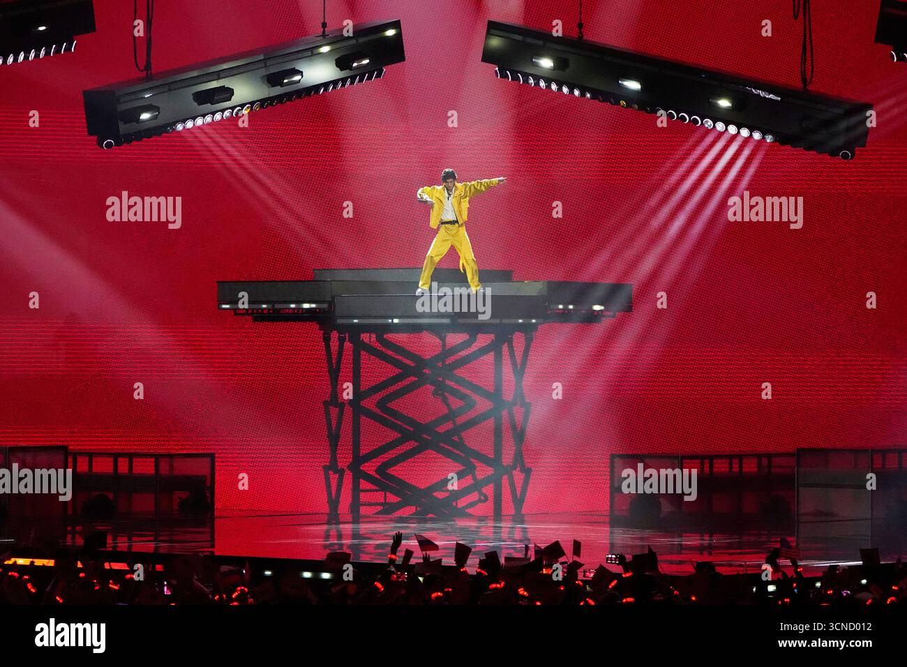 Tajikistan's Farrukh Hasanov performs the song "Burn!" at the International Music Competition ...